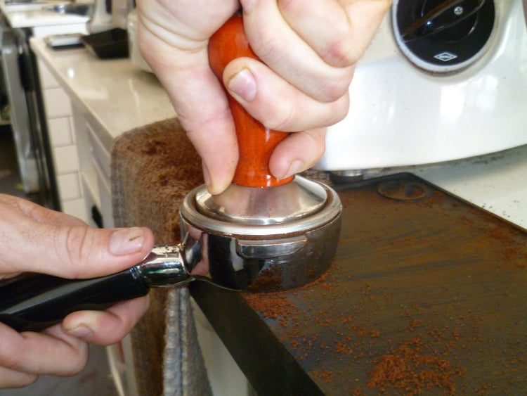 How hard should I tamp the ground coffee beans? – BlackMarket Coffee